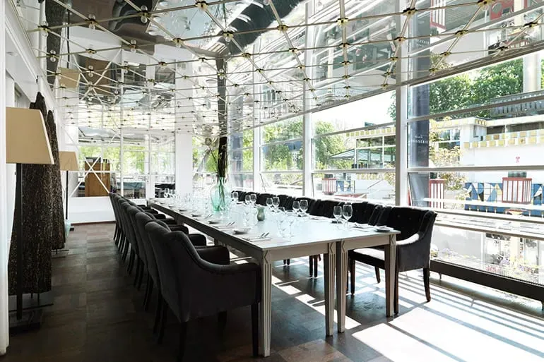 Glass Pavilion With Mirrored Ceilings for Relaxed Team Brunches in ...